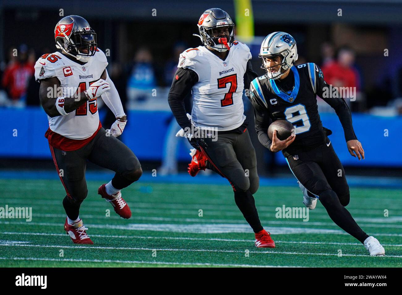 Carolina Panthers quarterback Bryce Young (9) runs out of the pocket against the Tampa Bay ...