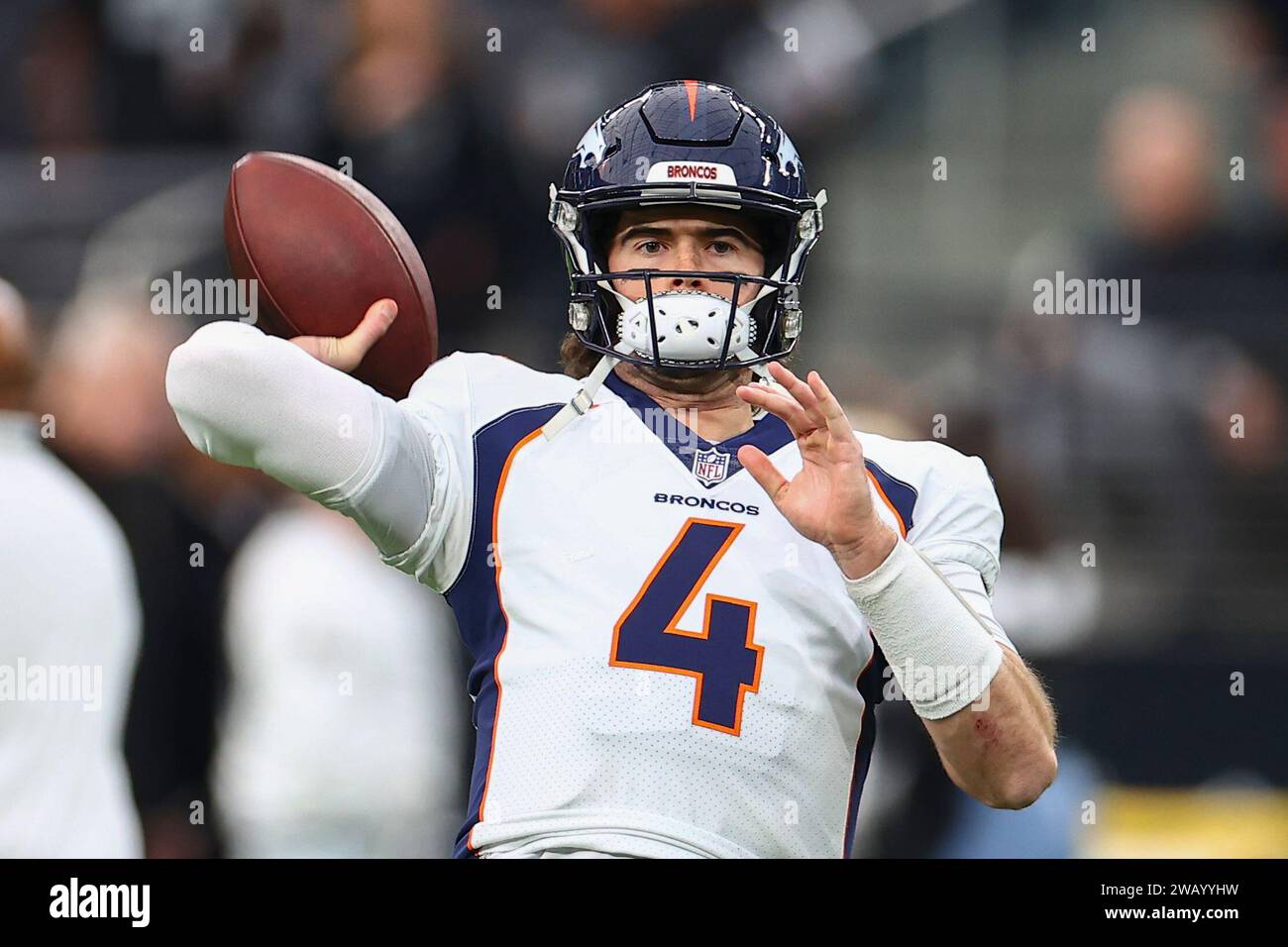 Denver Broncos quarterback Jarrett Stidham works out prior to an NFL football game against the ...