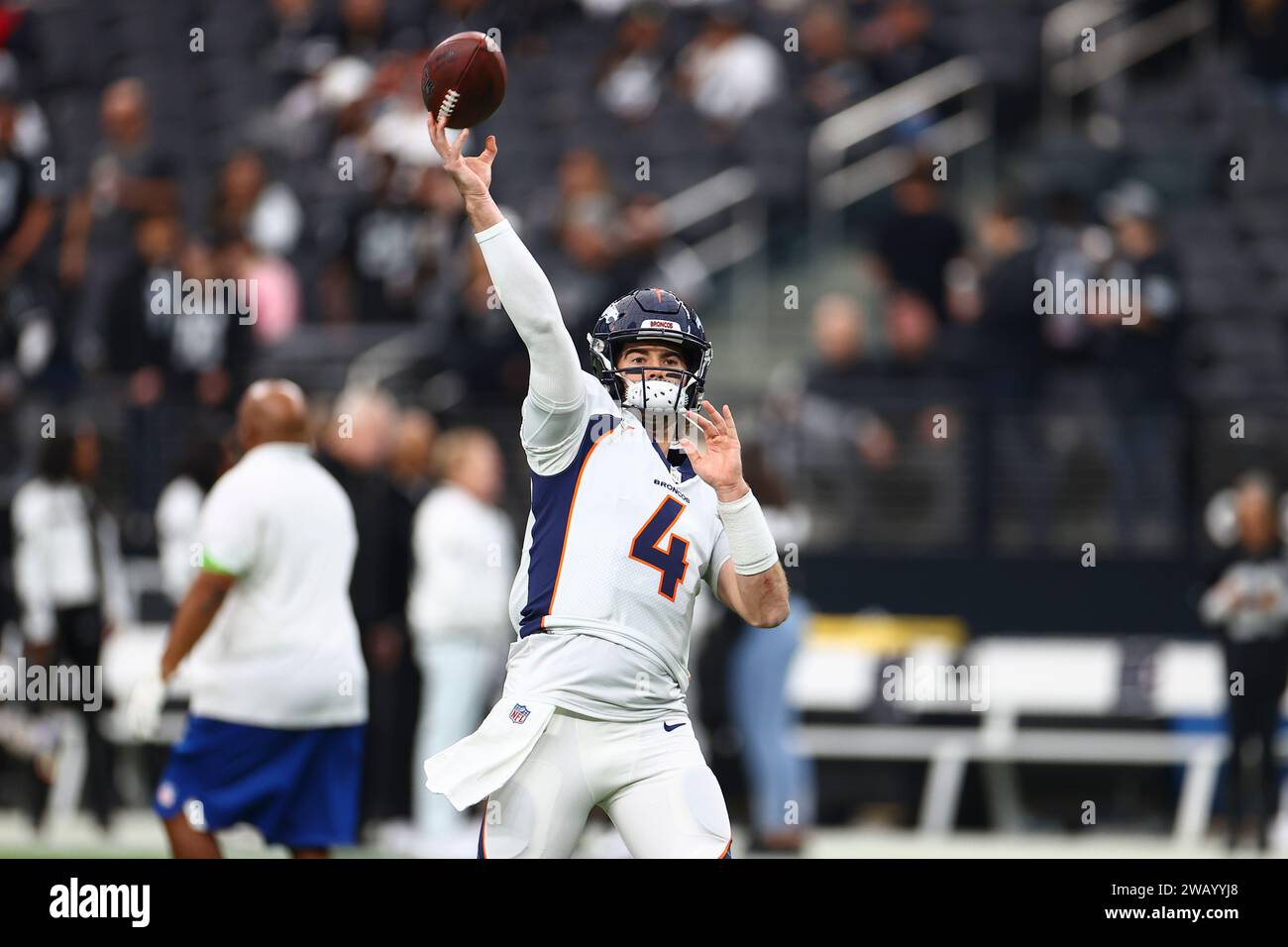 Denver Broncos quarterback Jarrett Stidham works out prior to an NFL football game against the ...