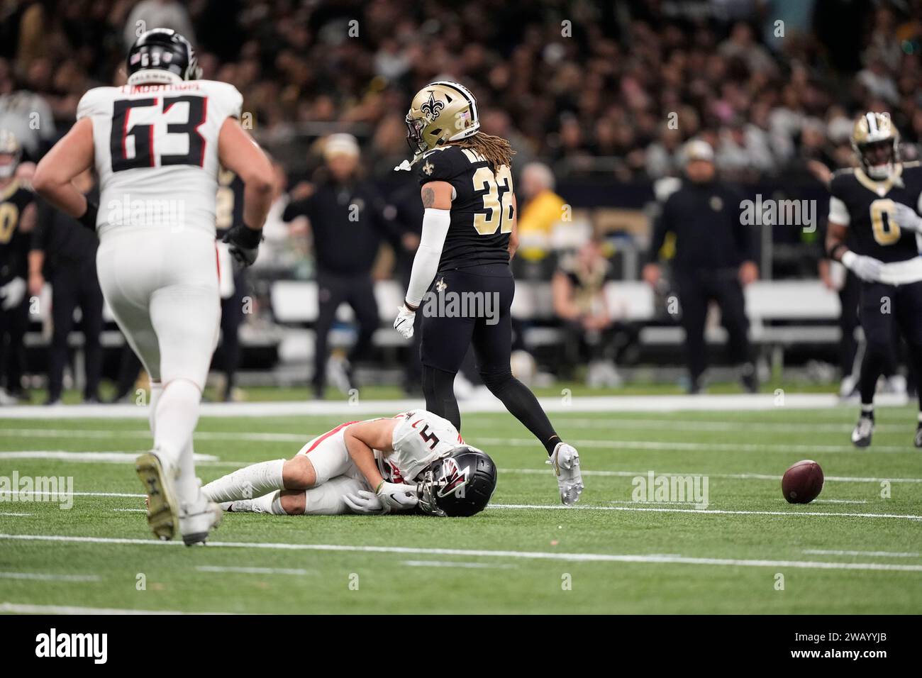 Atlanta Falcons wide receiver Drake London (5) lays on the field after ...