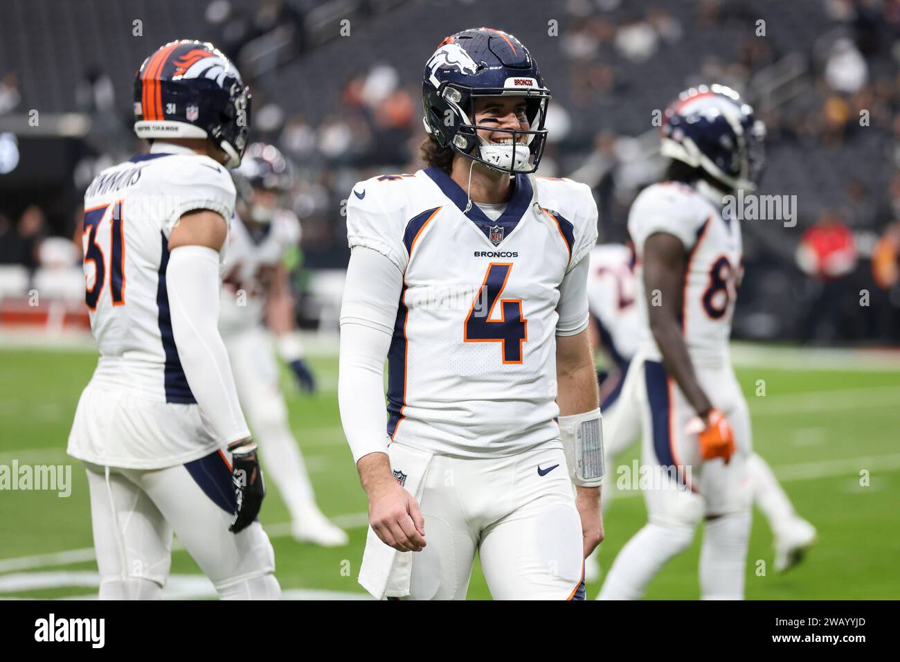 Denver Broncos quarterback Jarrett Stidham looks on while working out prior to an NFL football ...