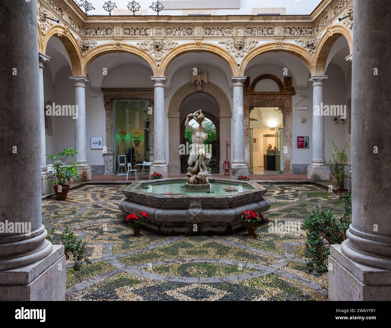 Palermo, Sicily, Italy, 15 December 2023 - Fountain and arched inner ...