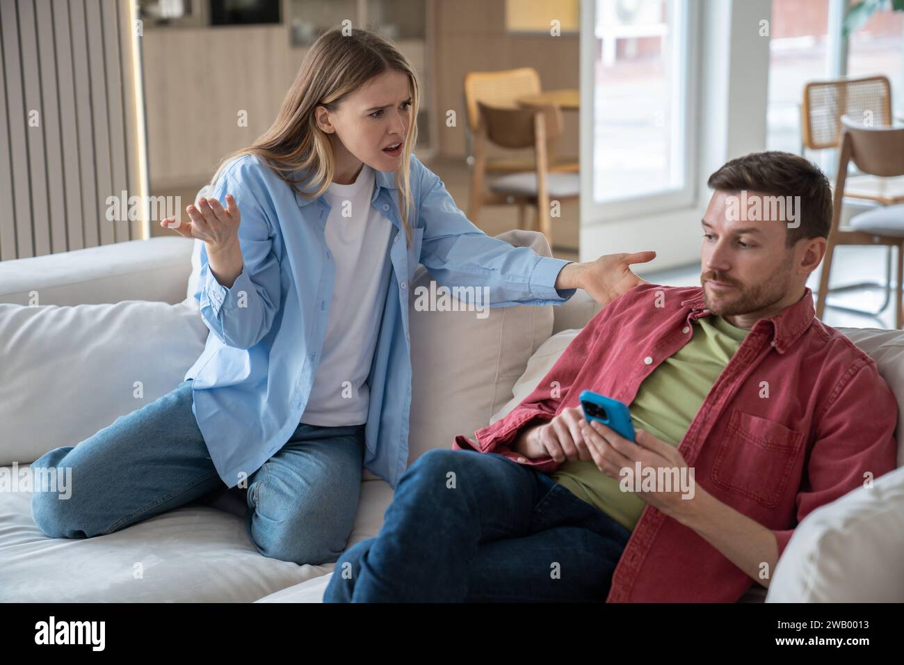 Angry irritated woman shouting at husband ignoring wife questions ...