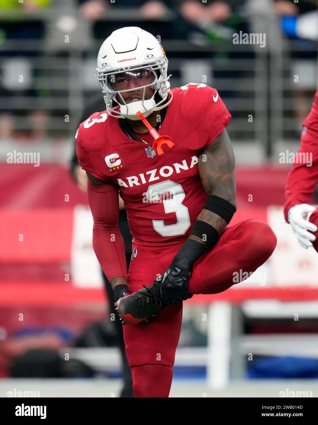 Arizona Cardinals safety Budda Baker warms up before an NFL football ...