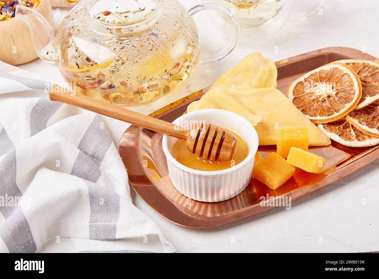Aesthetic tea time, herbal tea table setting with natural honey close ...