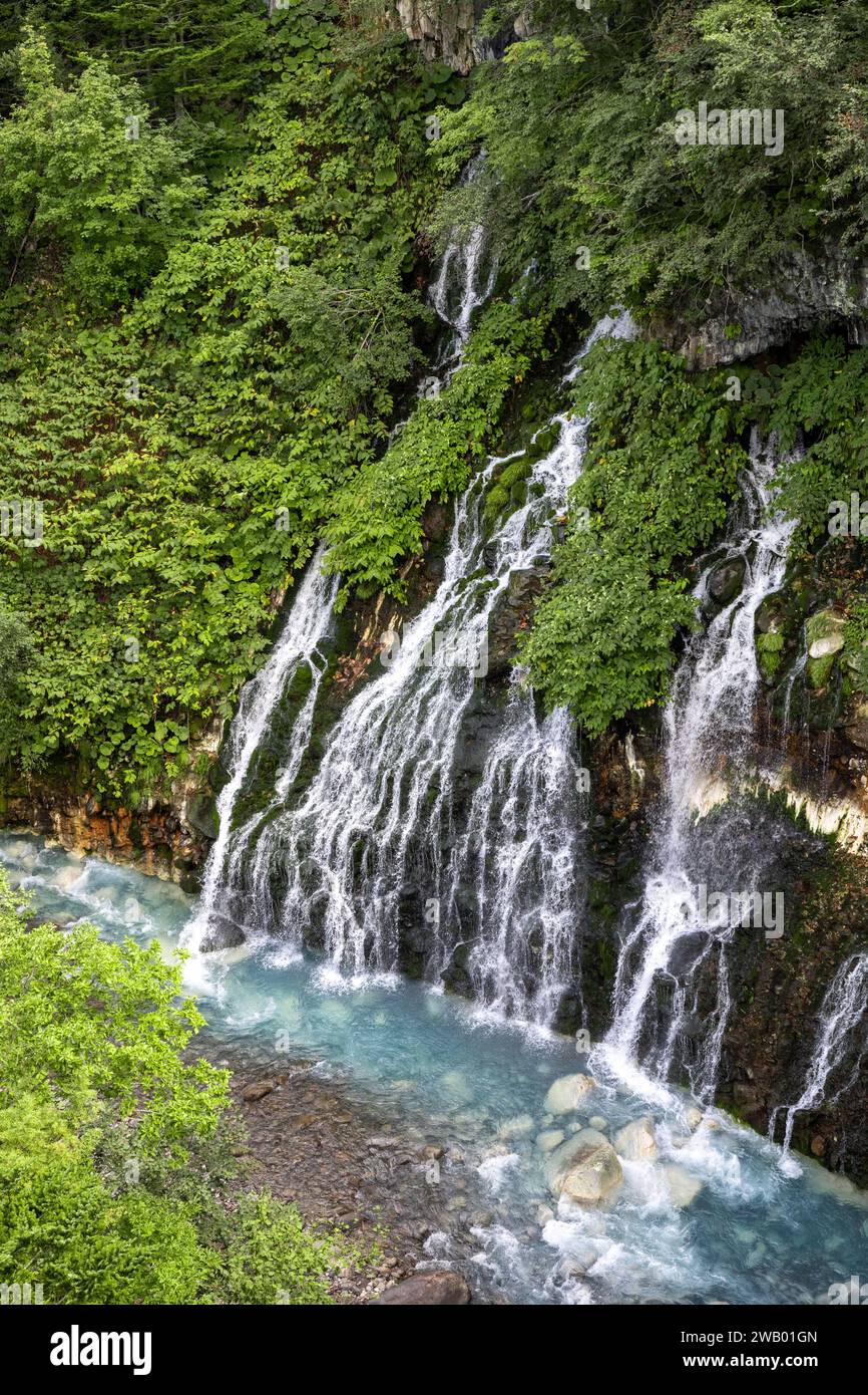 the blue waters of the shirahige waterfall in cental hokkaido near biei ...