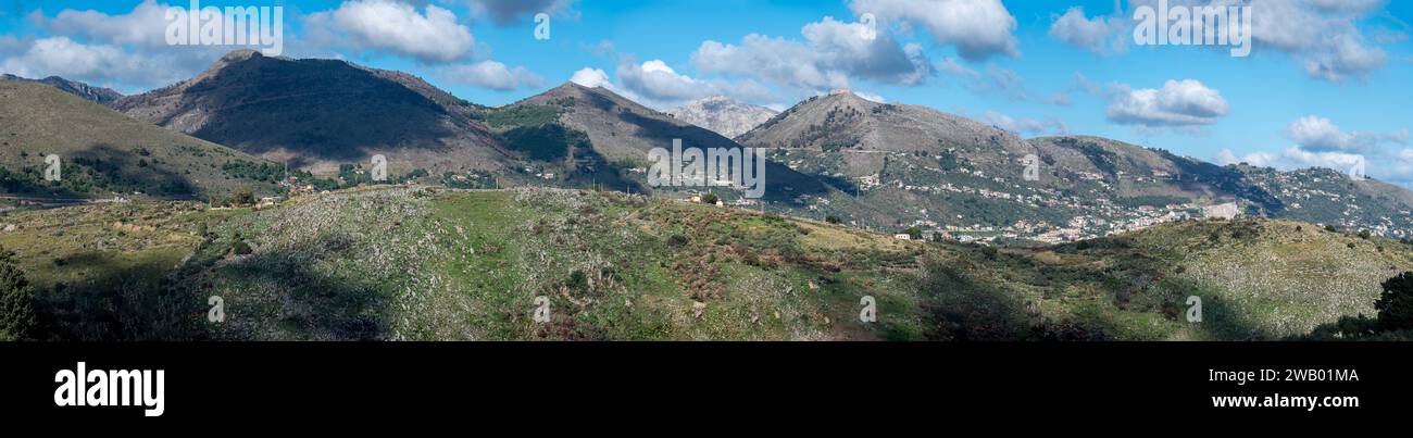 Extra large panoramic view over the rough mountains with houses and ...