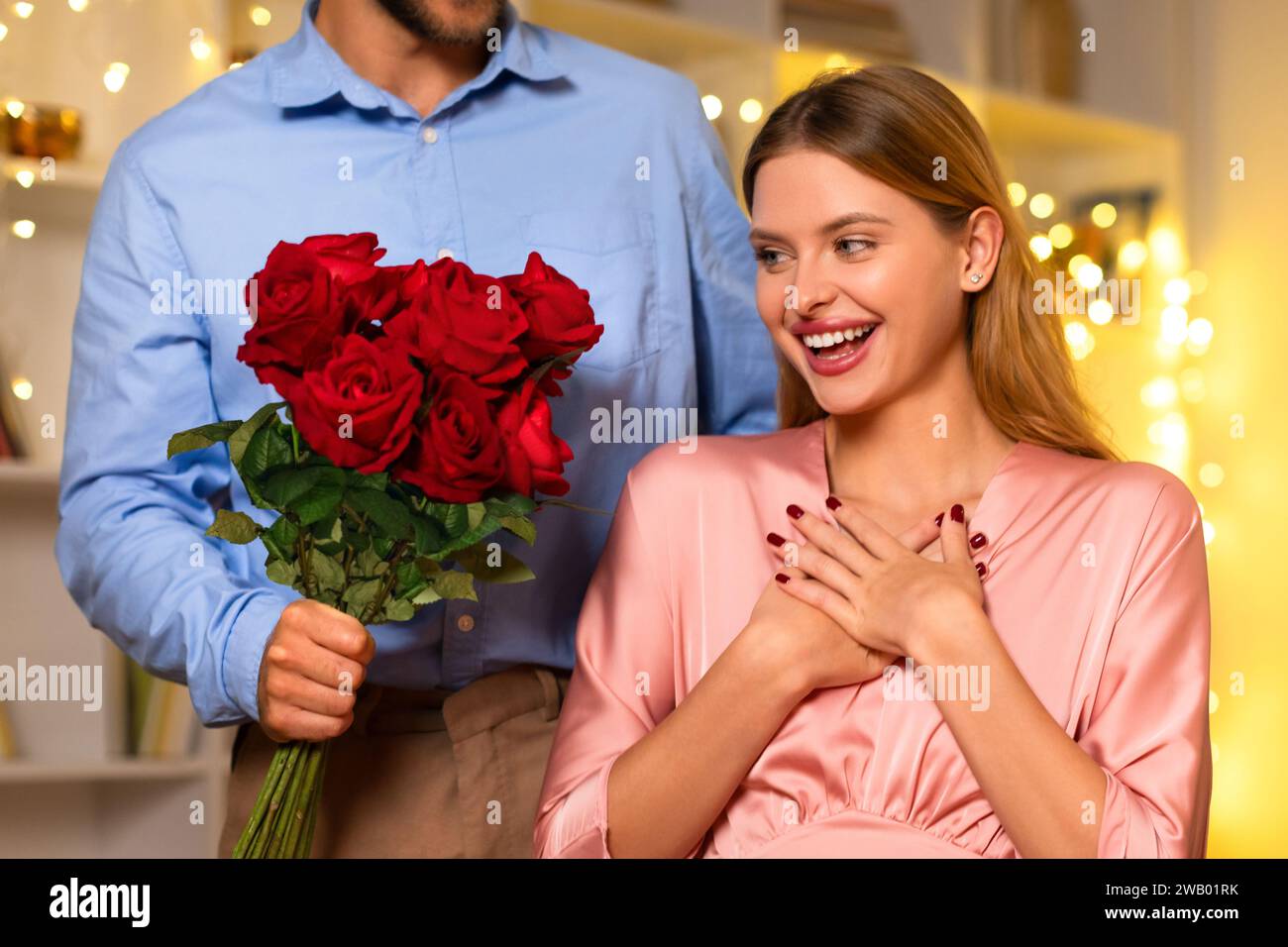 Woman receiving red roses hi-res stock photography and images - Alamy
