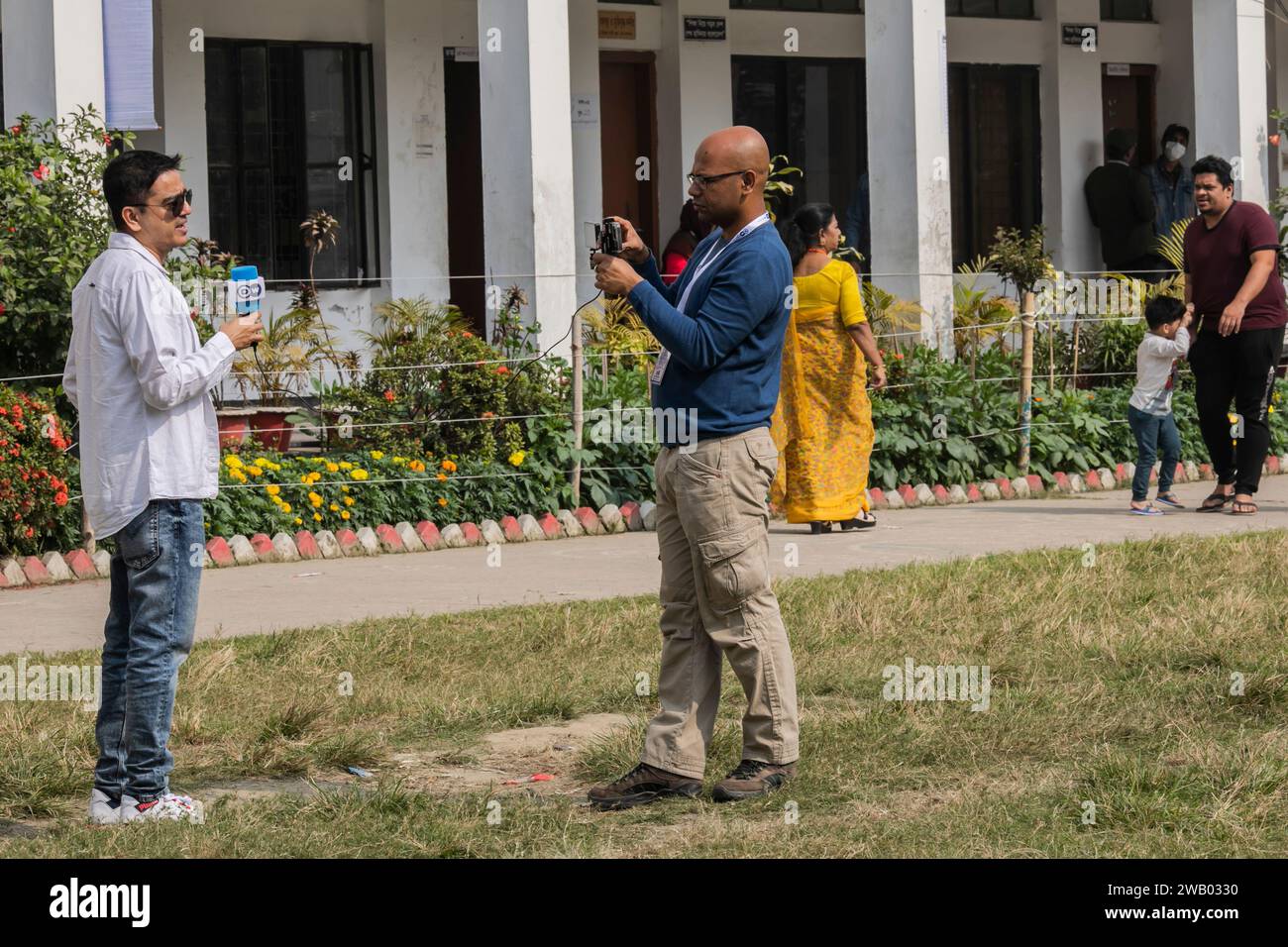 Deutsche Welle (DW) Multimedia journalists, Khaled Muhiuddin (L) and ...