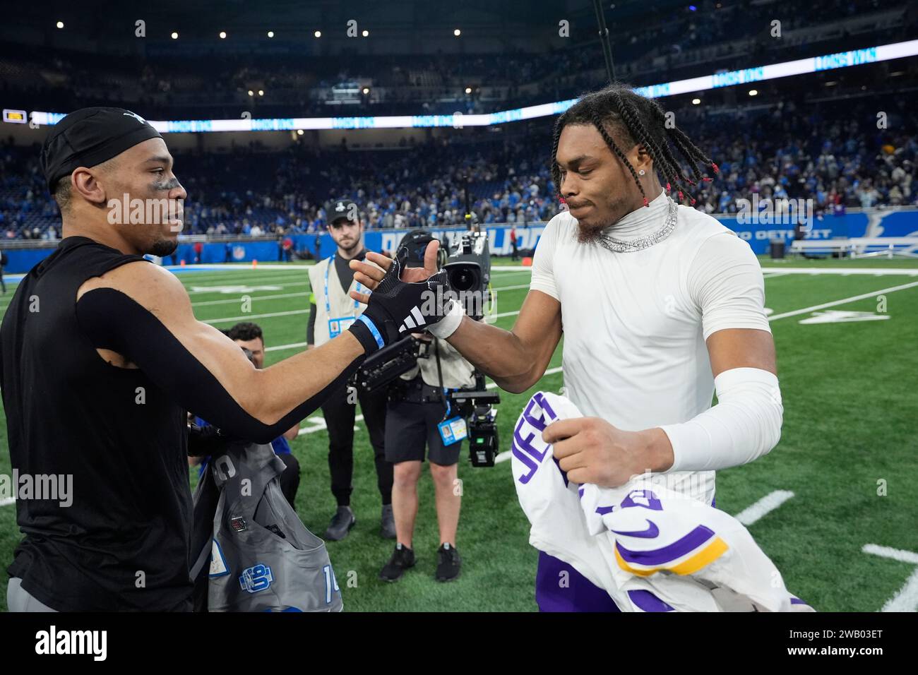 Detroit Lions wide receiver Amon-Ra St. Brown, left, and Minnesota ...