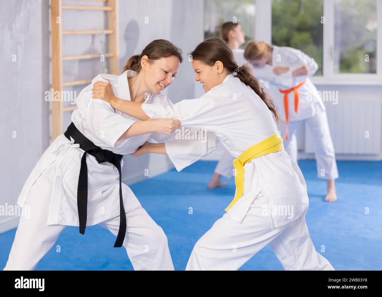 Females in kimono practicing fighting moves Stock Photo - Alamy