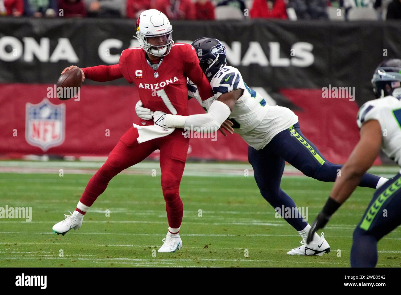 Arizona Cardinals quarterback Kyler Murray (1) is pressured by Seattle ...
