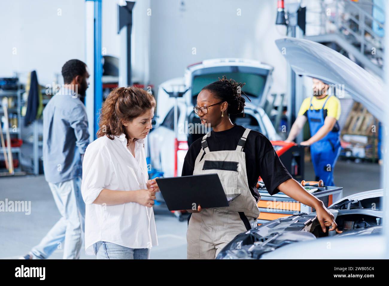 Precise mechanic at auto repair shop conducts annual vehicle checkup ...