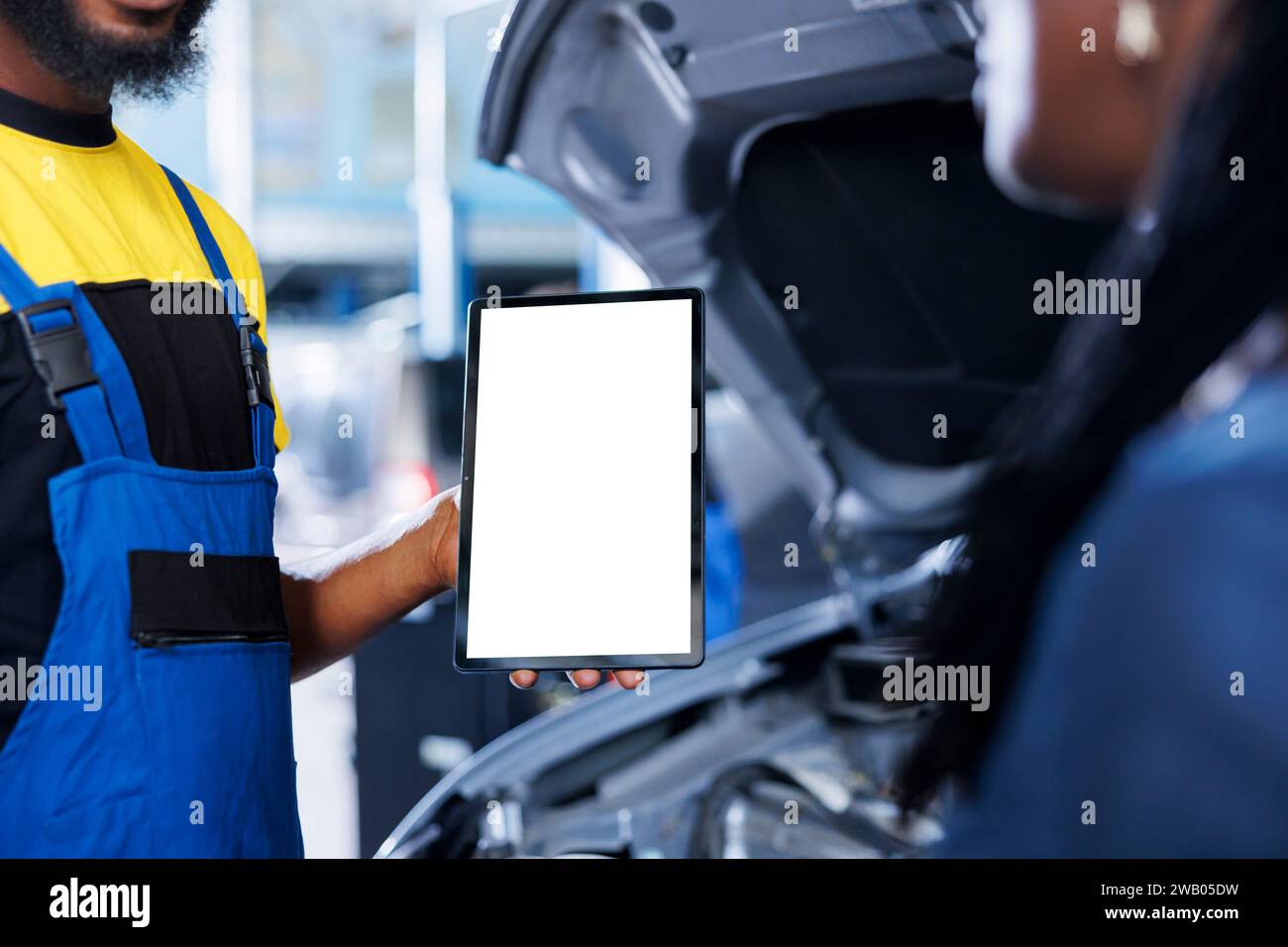 Repairman examining broken screen hi-res stock photography and images ...