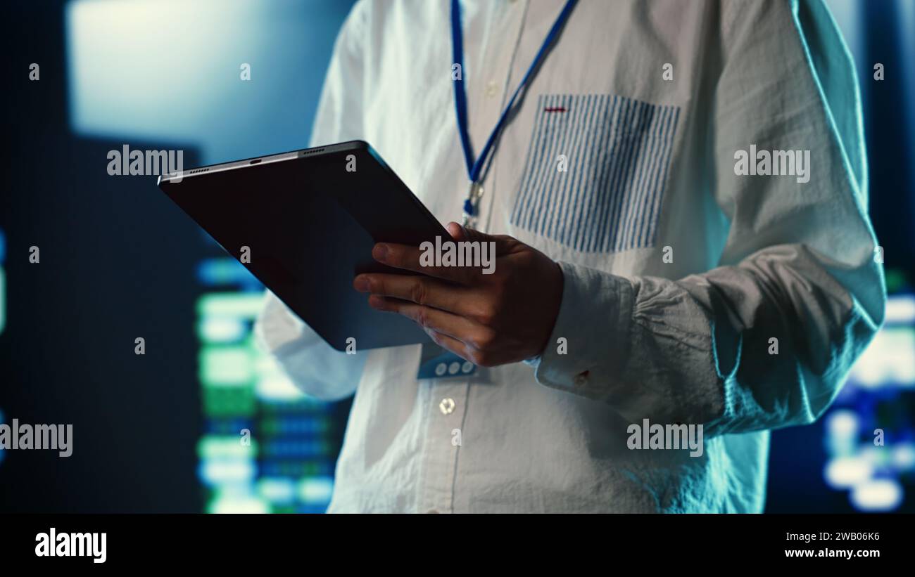 Efficient employee walking through data center units providing ... Efficient employee walking through data center units providing ...
