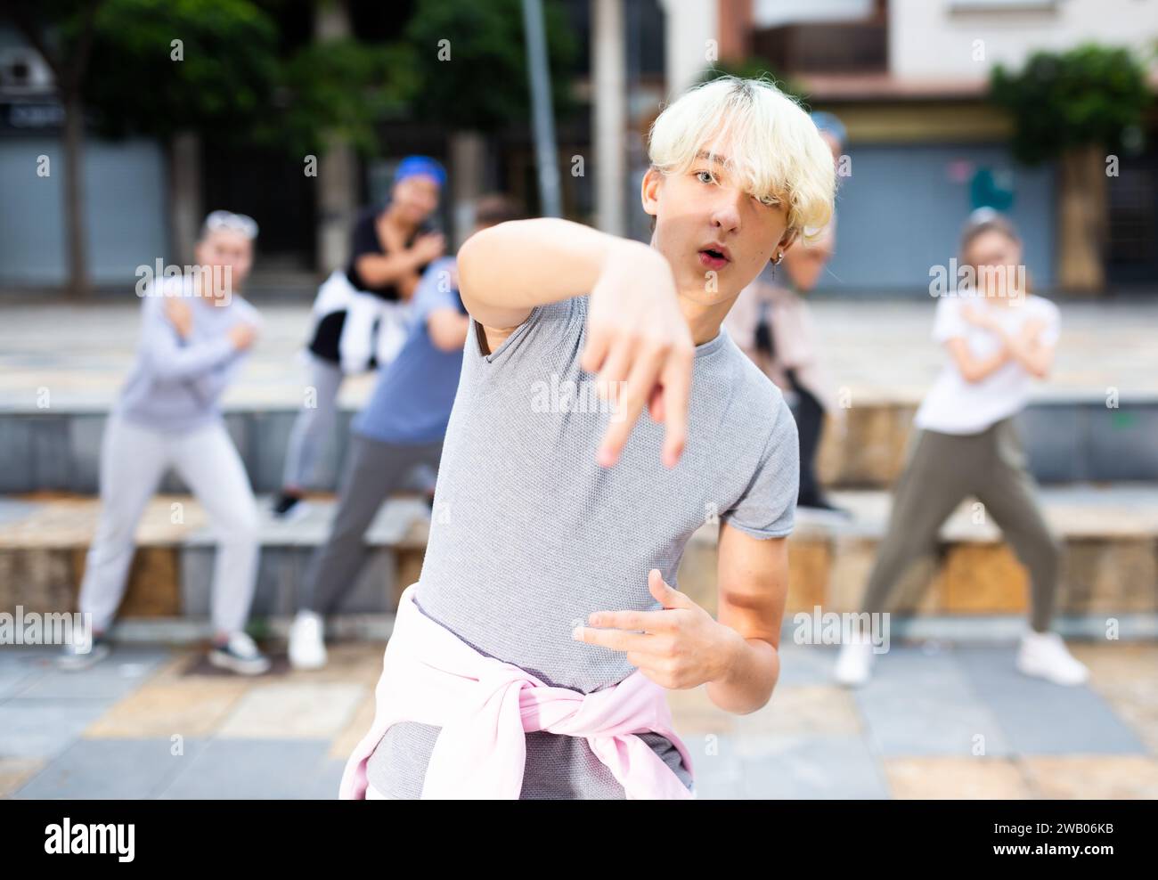 Teen boy dancing modern street dance with teenagers Stock Photo - Alamy