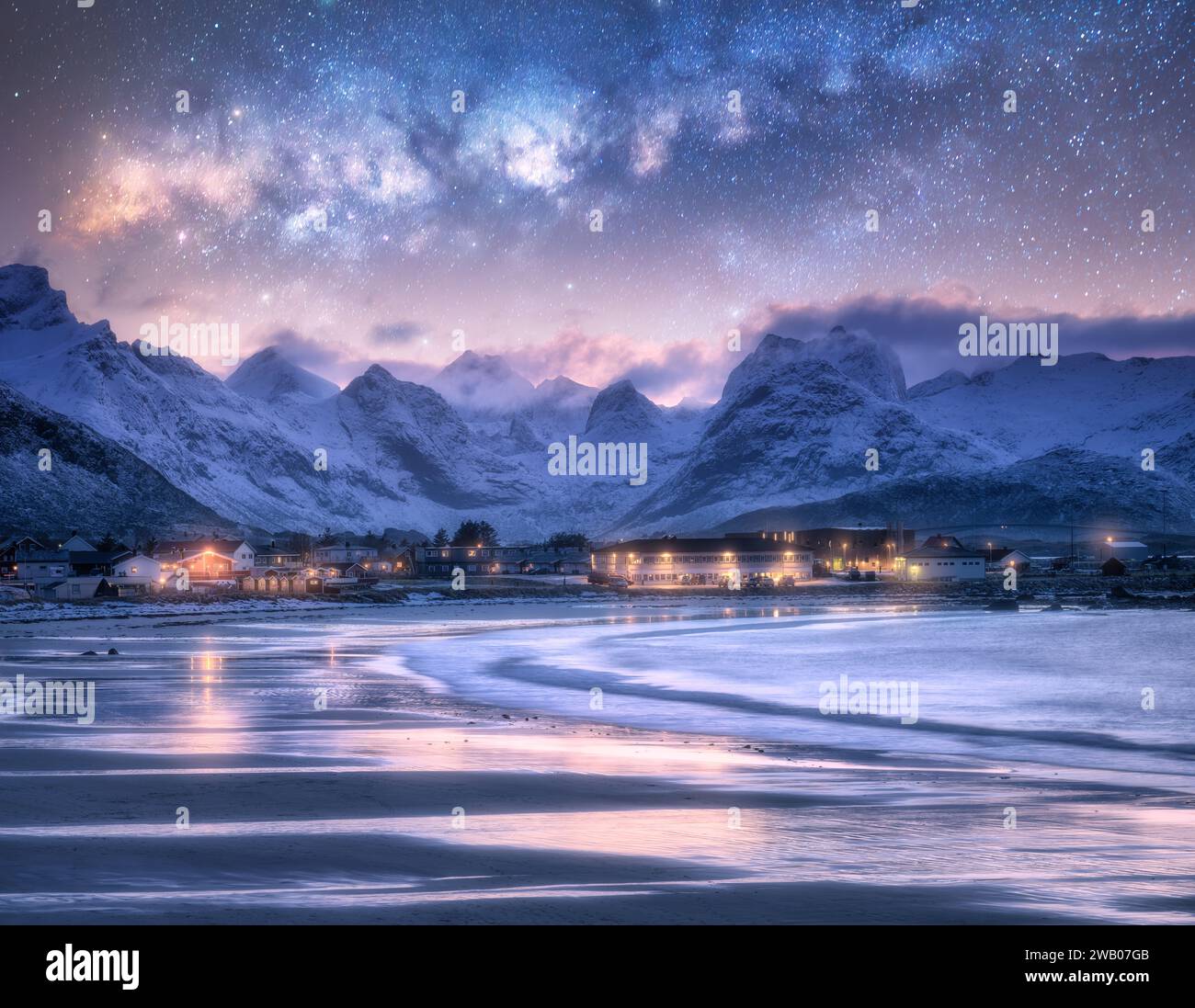 Milky Way, sandy beach, sea, snowy mountains, starry sky at night Stock ...