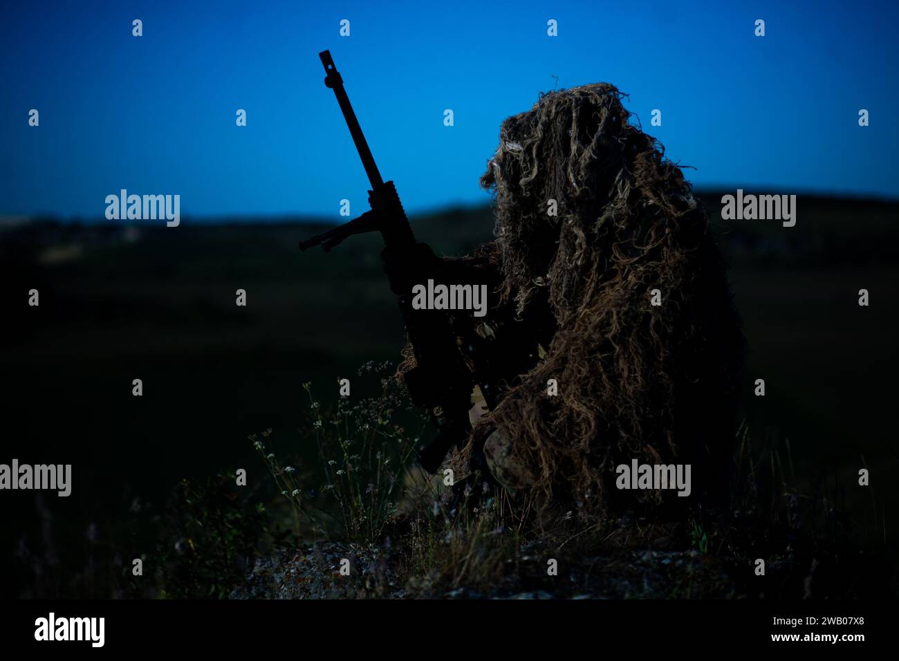 special operation forces sniper in ghillie (camouflage) suit with a ...