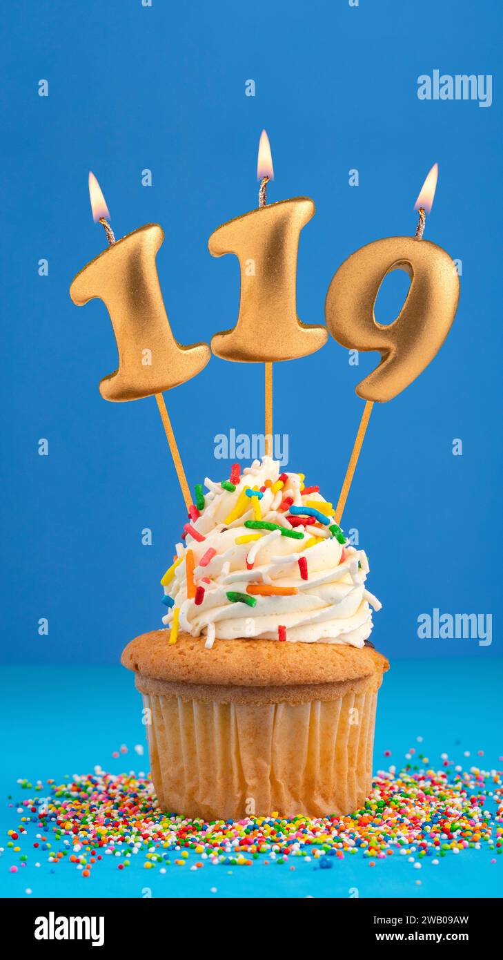 Candle number 119 - Cake birthday in blue background Stock Photo - Alamy