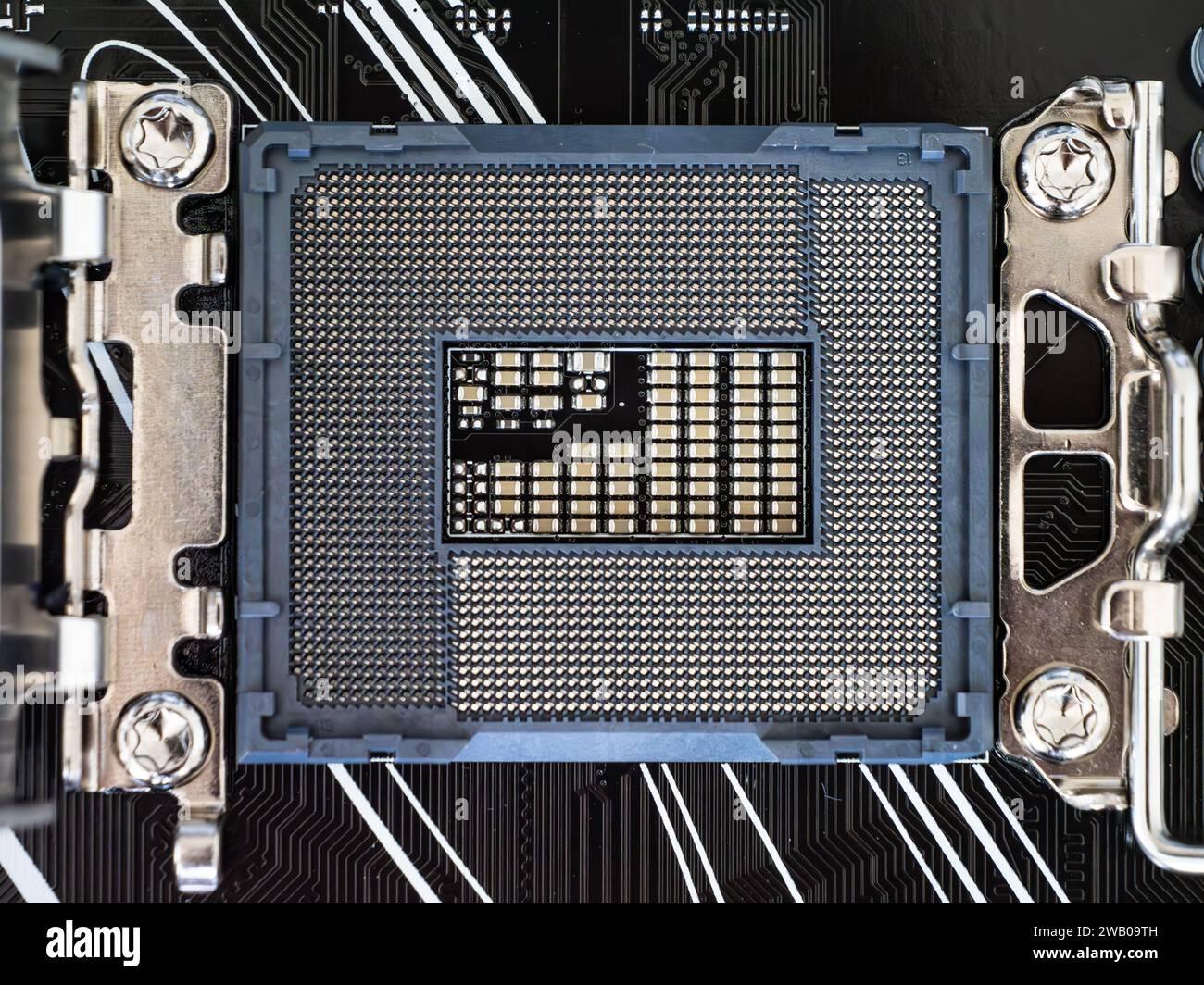 Closeup top view of a CPU socket on a black motherboard, semiconductor ...