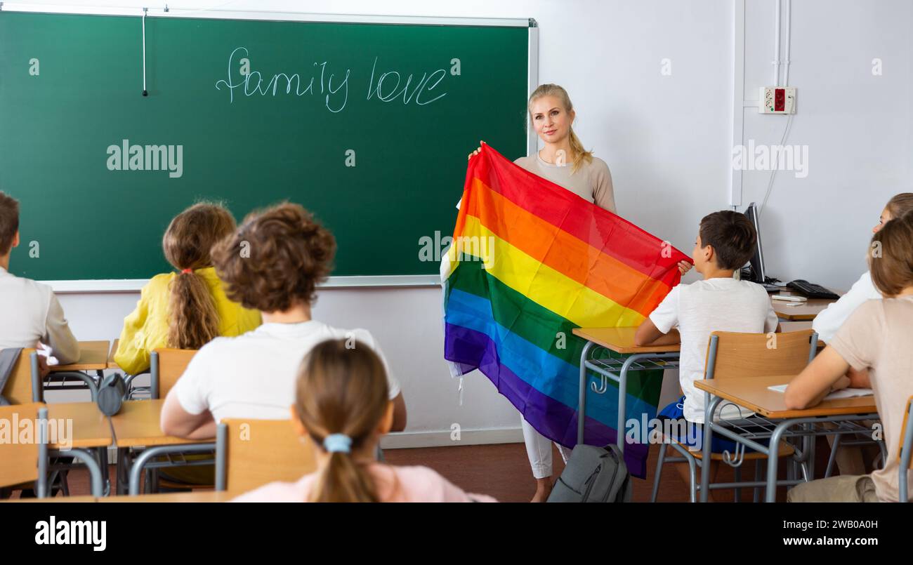 Progressive female teacher discussing with teenage students about LGBT ...