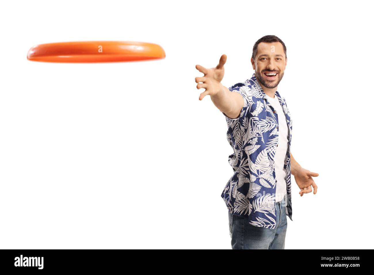 Cheerful young man throwing a flying disk isolated on white background ...