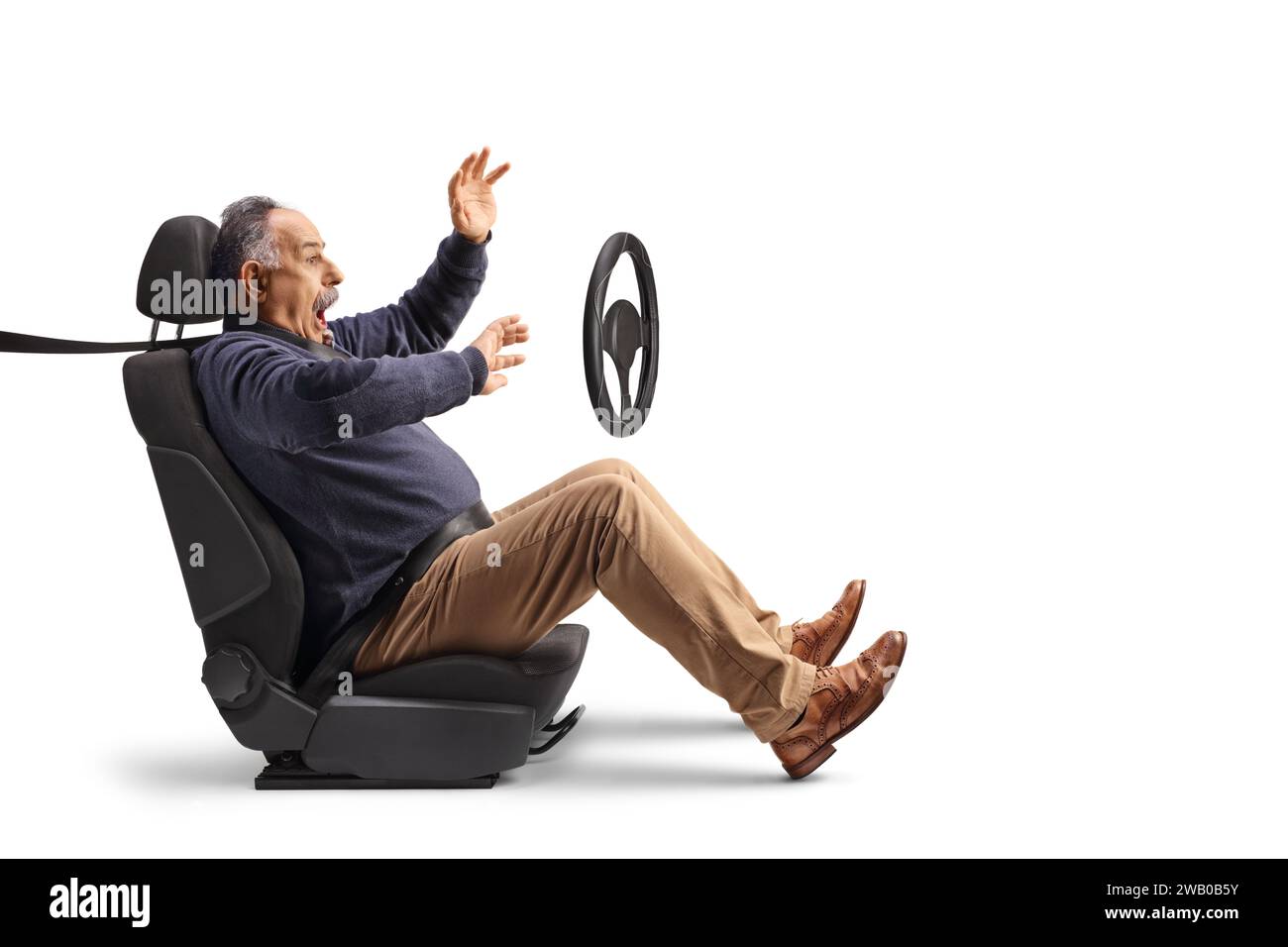 Scared driver behind a steering wheel isolated on white background ...