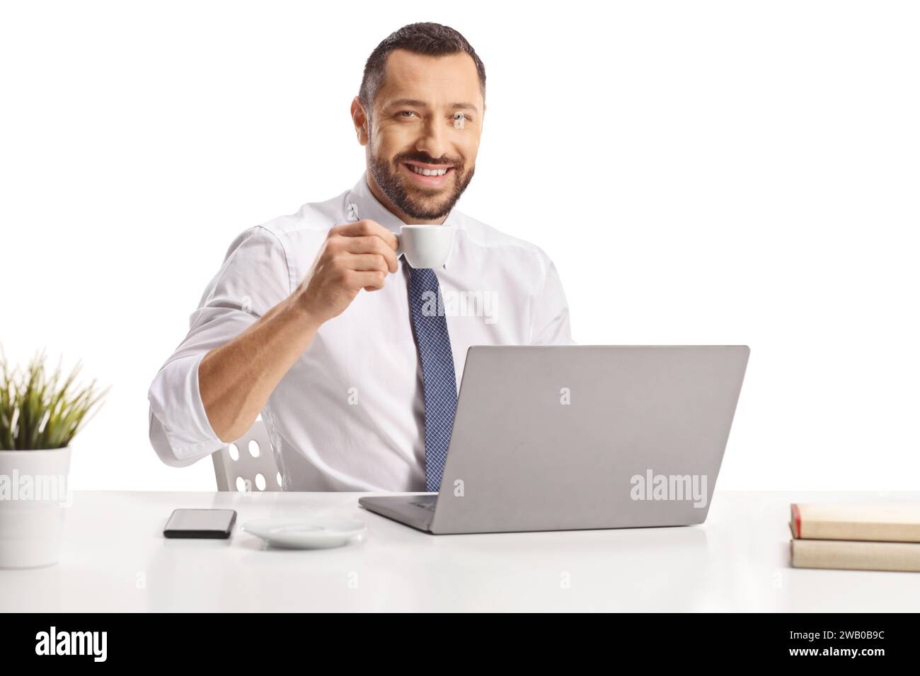 Man drinking espresso coffee and working on a laptop computer isolated ...