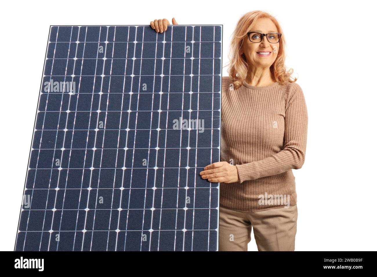 Causal mature woman behind a solar panel isolated on white background ...