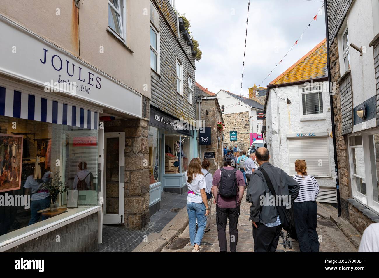St Ives town centre in Cornwall, shoppers and visitors on Fore street ...