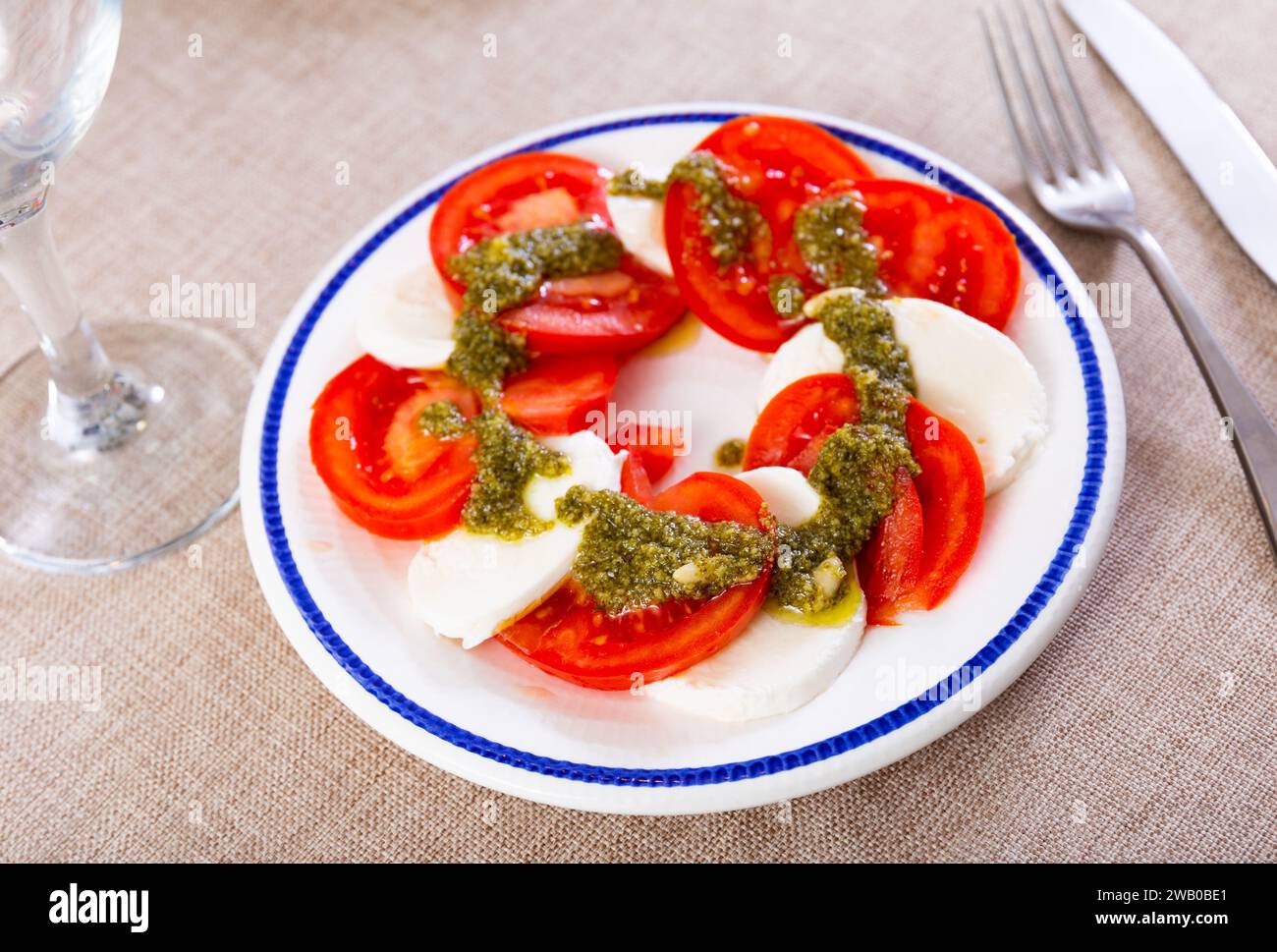 Traditional snack of Italian cuisine is Caprese with basil and Pesto ...