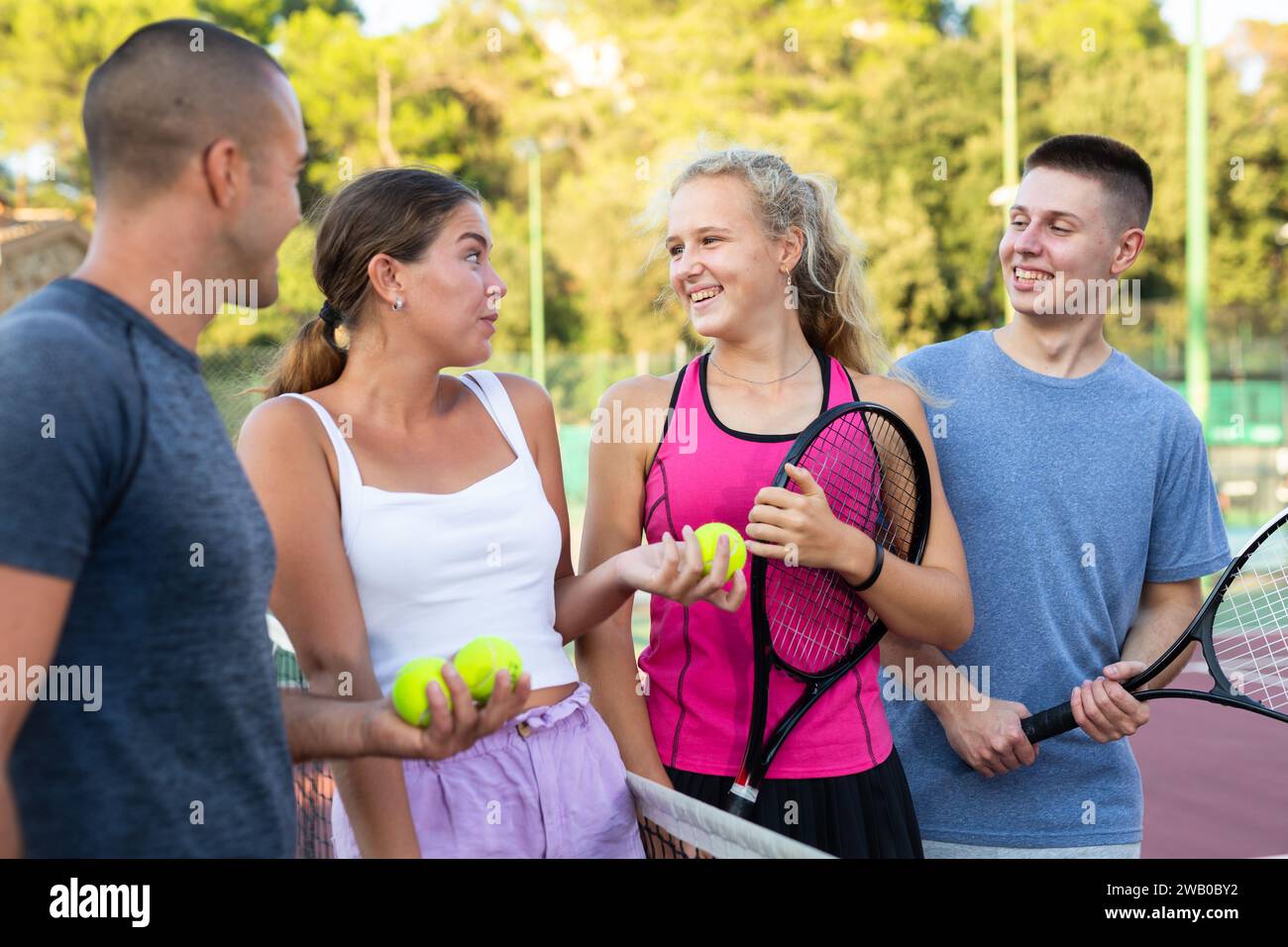 Group photo of positive people talking Stock Photo - Alamy