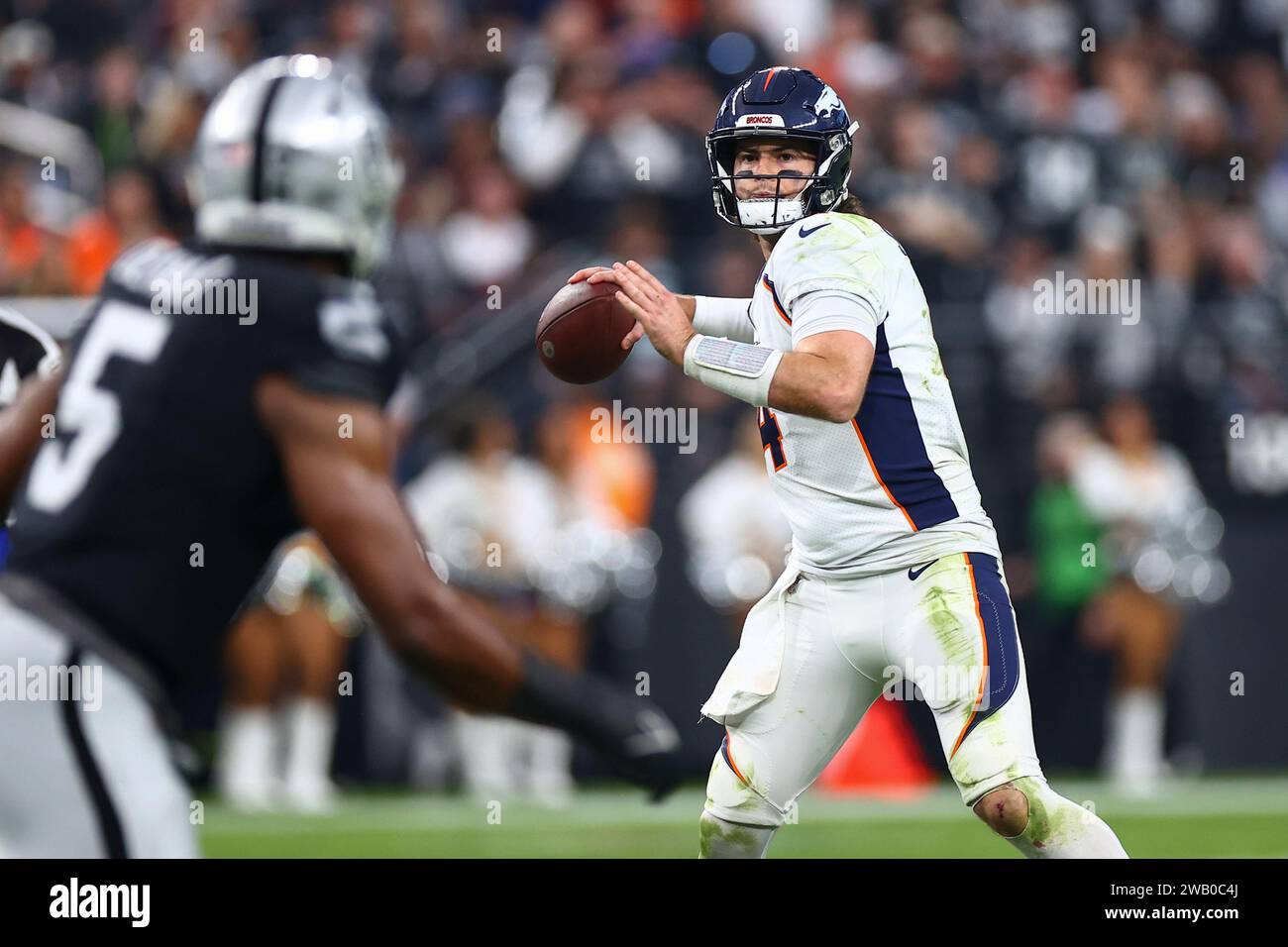 Denver Broncos quarterback Jarrett Stidham throws a pass against the ...