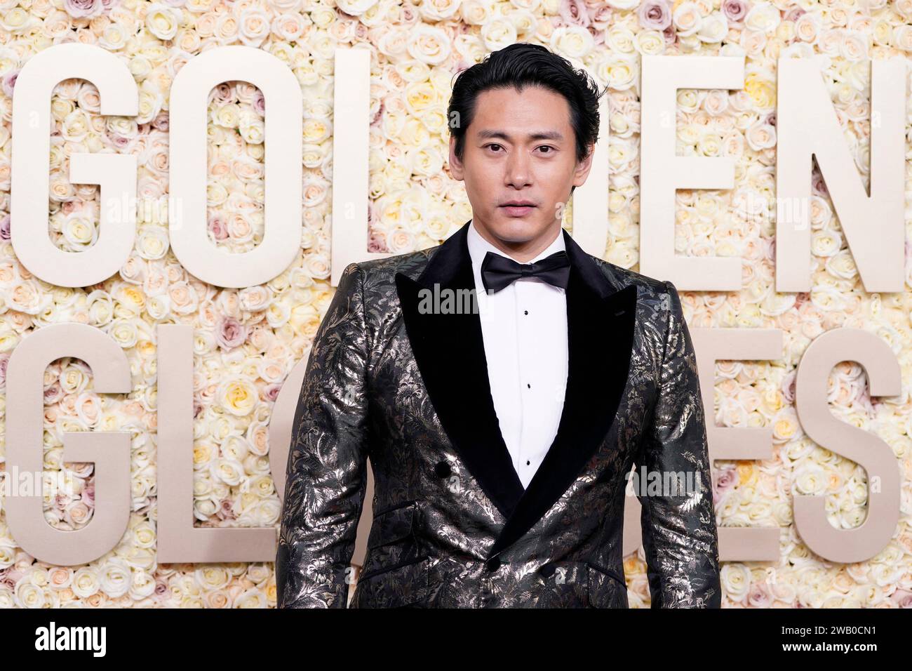 Teo Yoo arrives at the 81st Golden Globe Awards on Sunday, Jan. 7, 2024 ...
