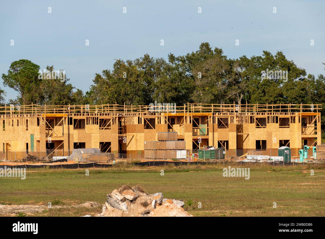 A large three-story residential wooden apartment or condo building is ...