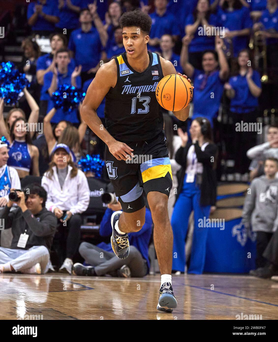 Marquette Golden Eagles forward Oso Ighodaro (13) brings the ball up ...