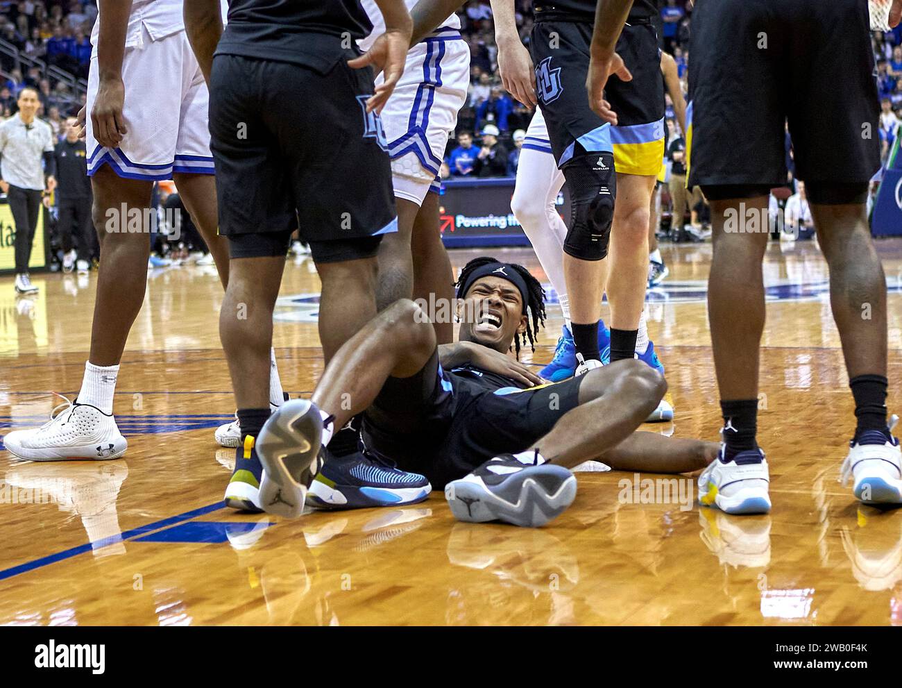 Marquette Golden Eagles guard Chase Ross (2) goes down with an injury ...