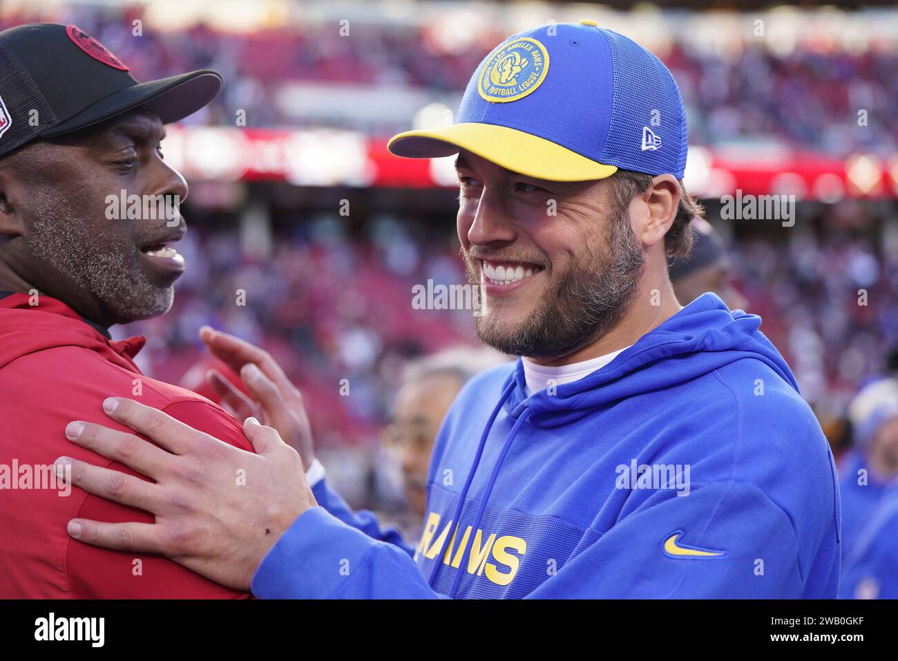 San Francisco 49ers assistant coach Anthony Lynn, left, talks with Los ...