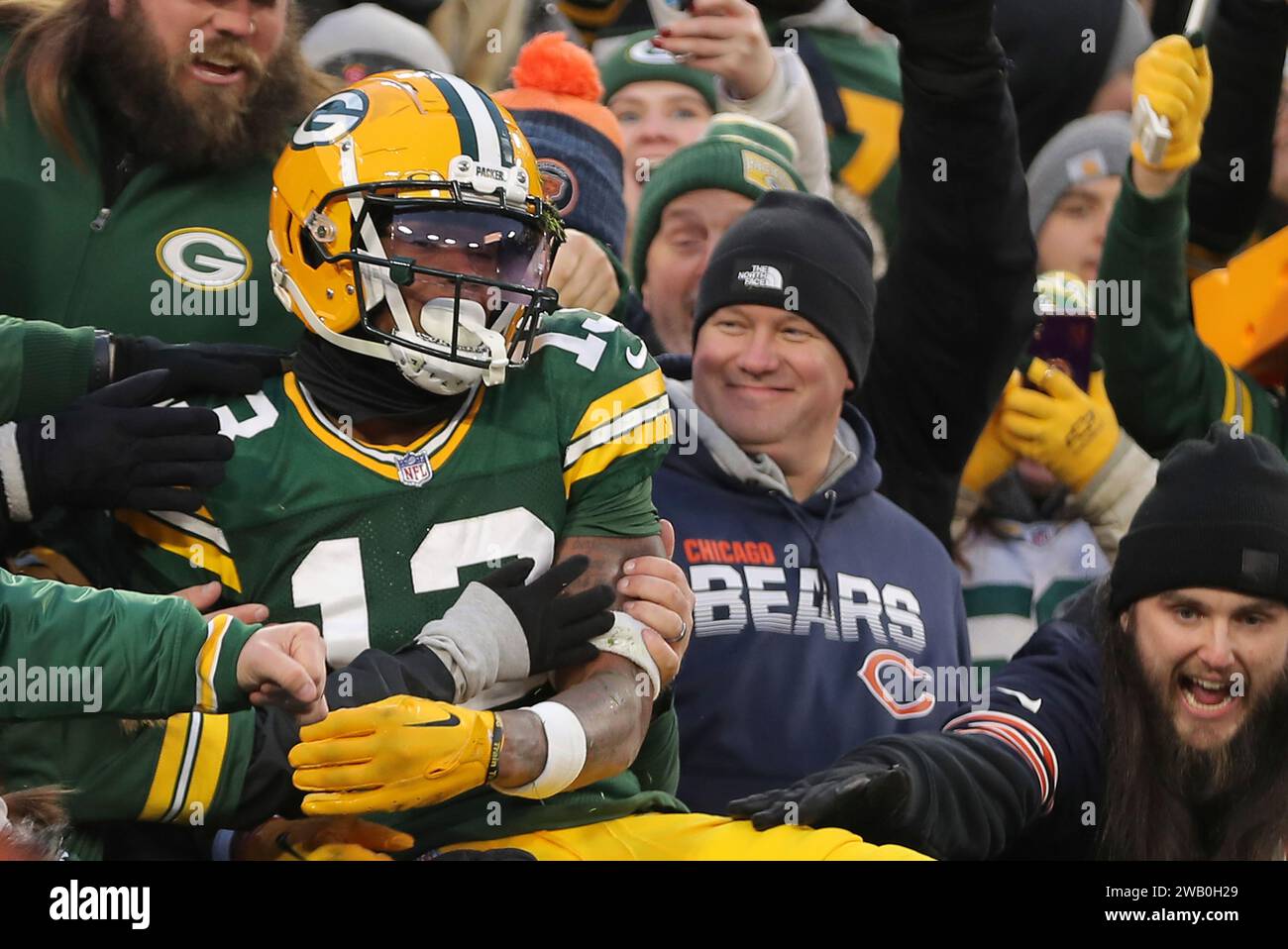 Green Bay Packers wide receiver Dontayvion Wicks (13) jumps into the ...