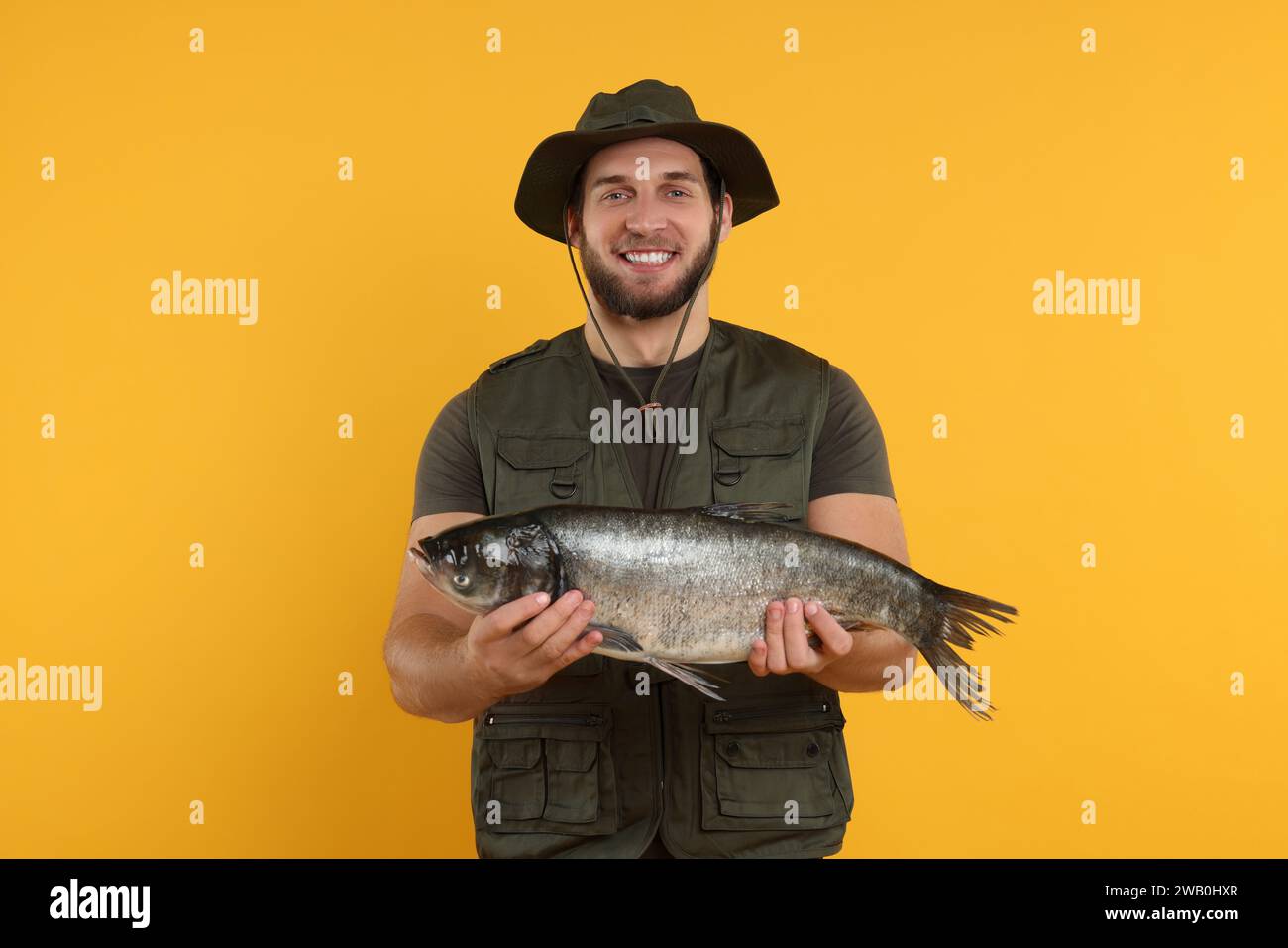 Fisherman with caught fish hi-res stock photography and images - Alamy