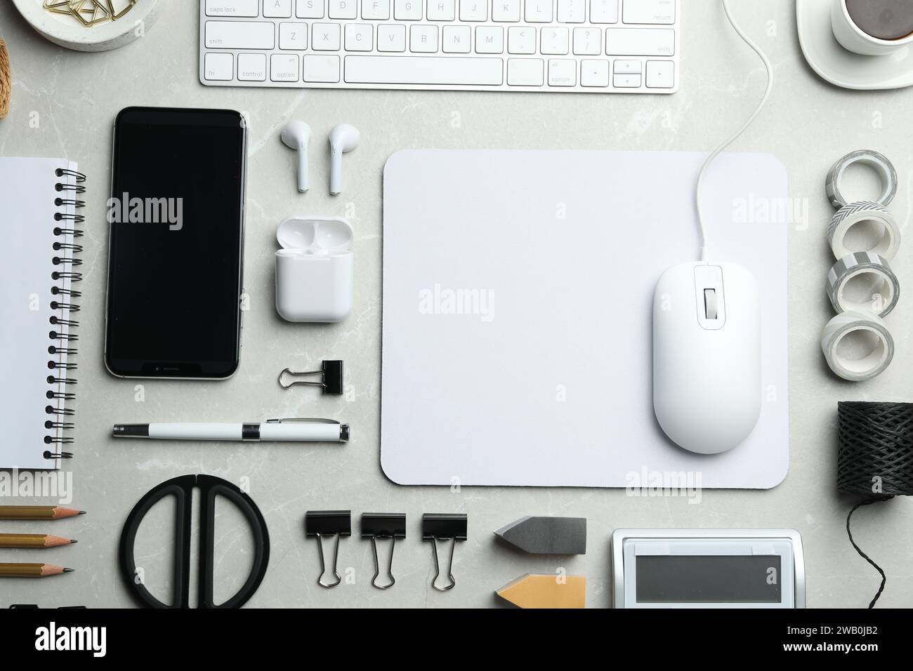 Flat lay composition with wired computer mouse and stationery on light ...