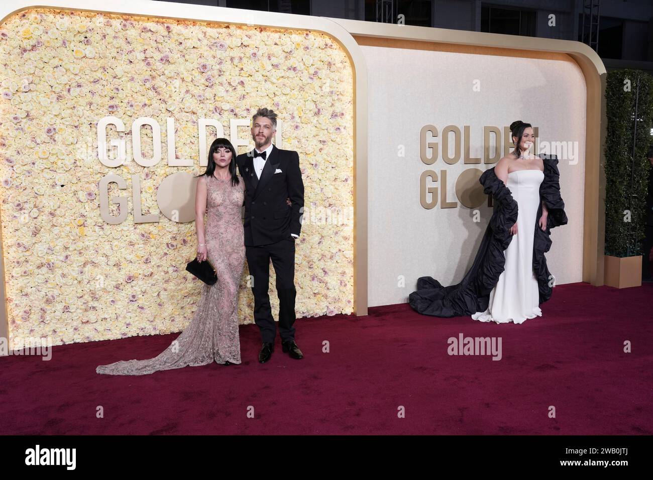 Christina Ricci, from left, Mark Hampton, and Lily Gladstone arrive at ...