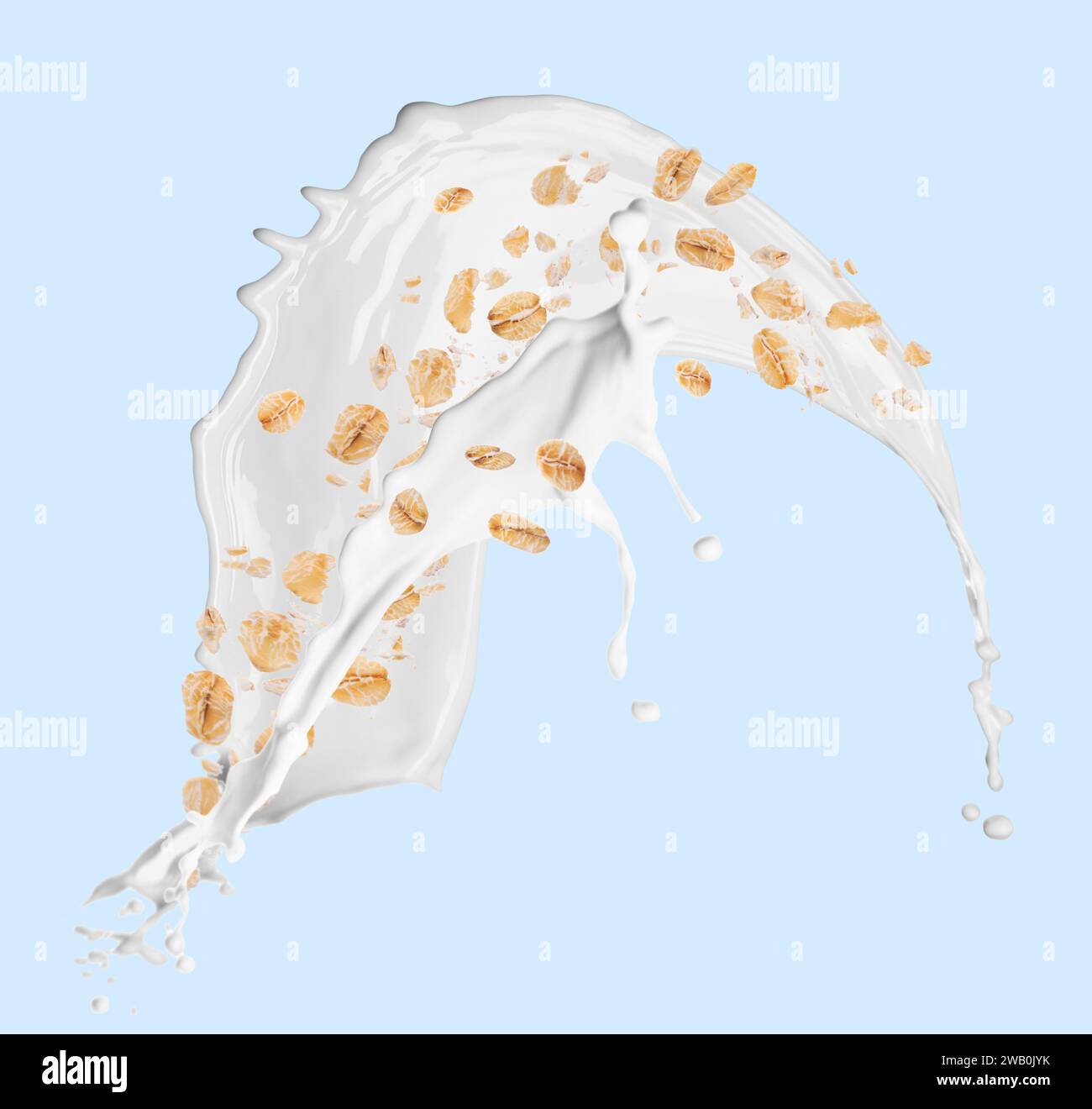 Rolled oats and milk splash on light blue background Stock Photo - Alamy