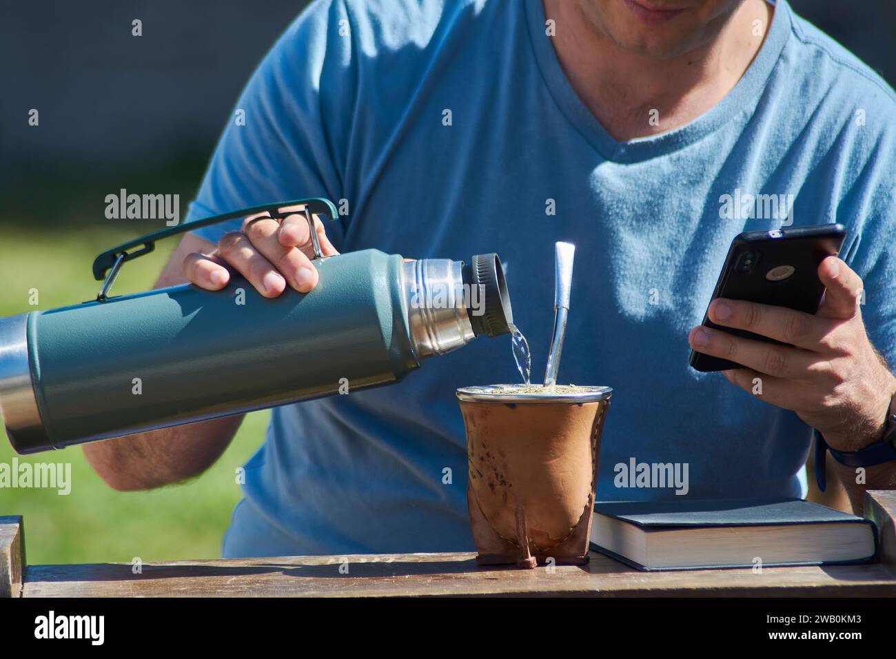 Hispanic man drinking a traditional Latin American yerba mate tea. The ...