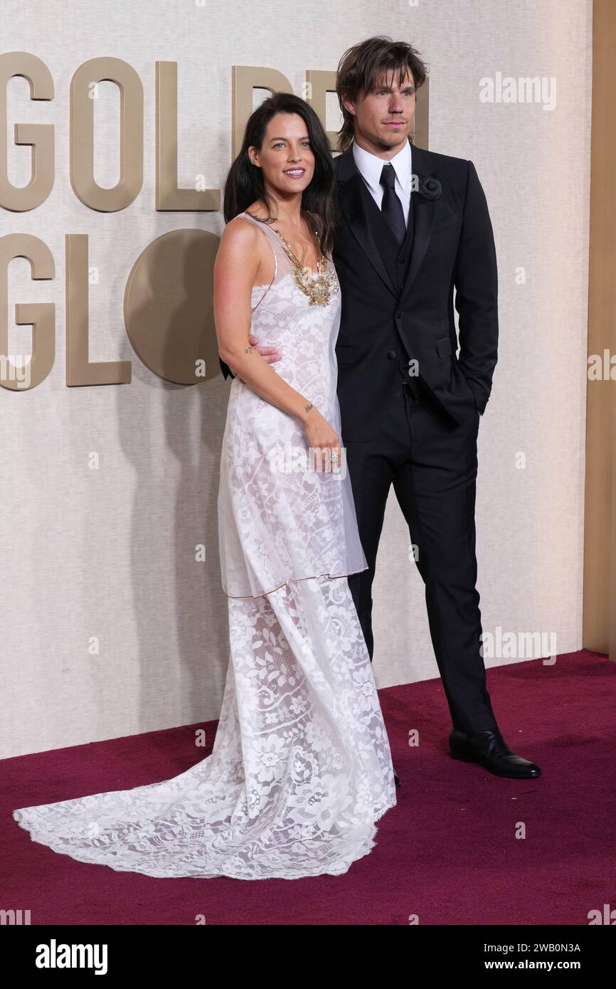 Riley Keough, left, and Ben Smith-Petersen arrive at the 81st Golden ...