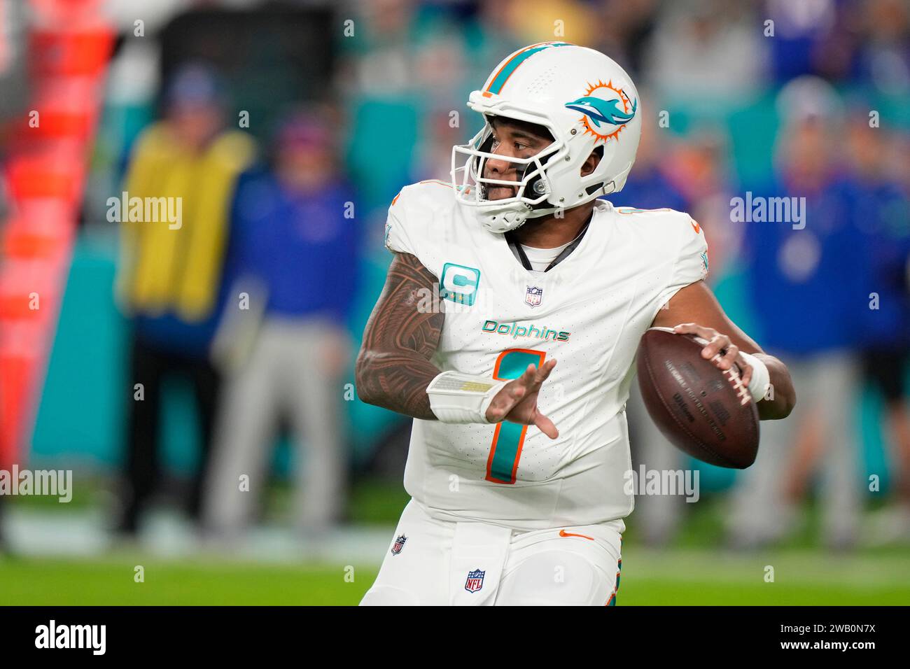 Miami Dolphins quarterback Tua Tagovailoa (1) aims a pass during the first half of an NFL ...
