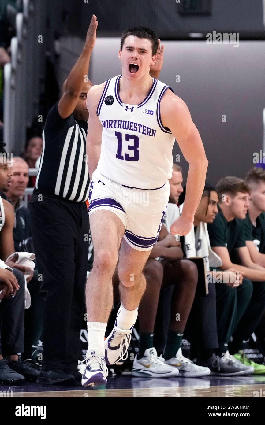 Northwestern guard Brooks Barnhizer reacts after making a three-point ...