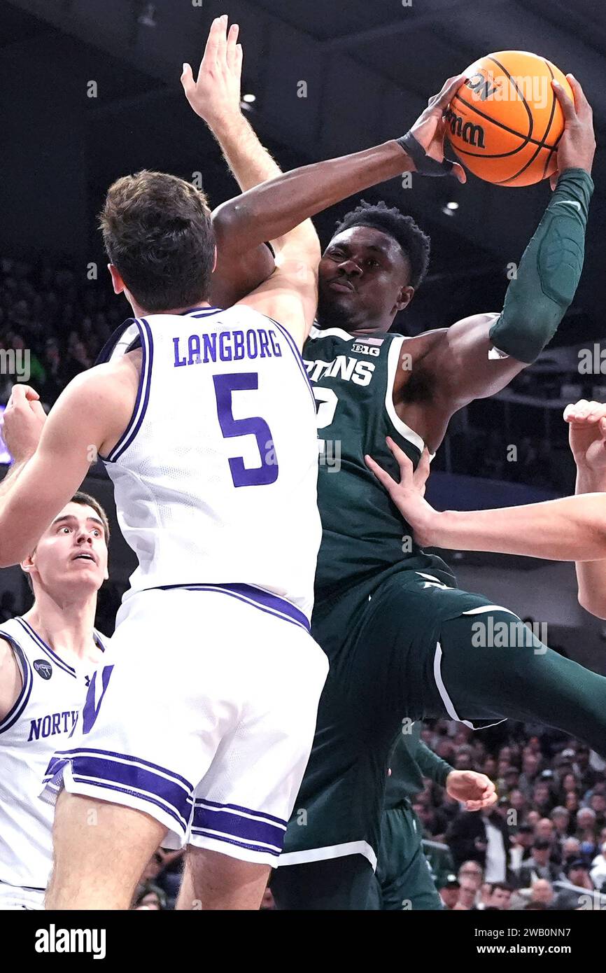 Michigan State center Mady Sissoko, right, rebounds the ball against Northwestern guard Ryan ...