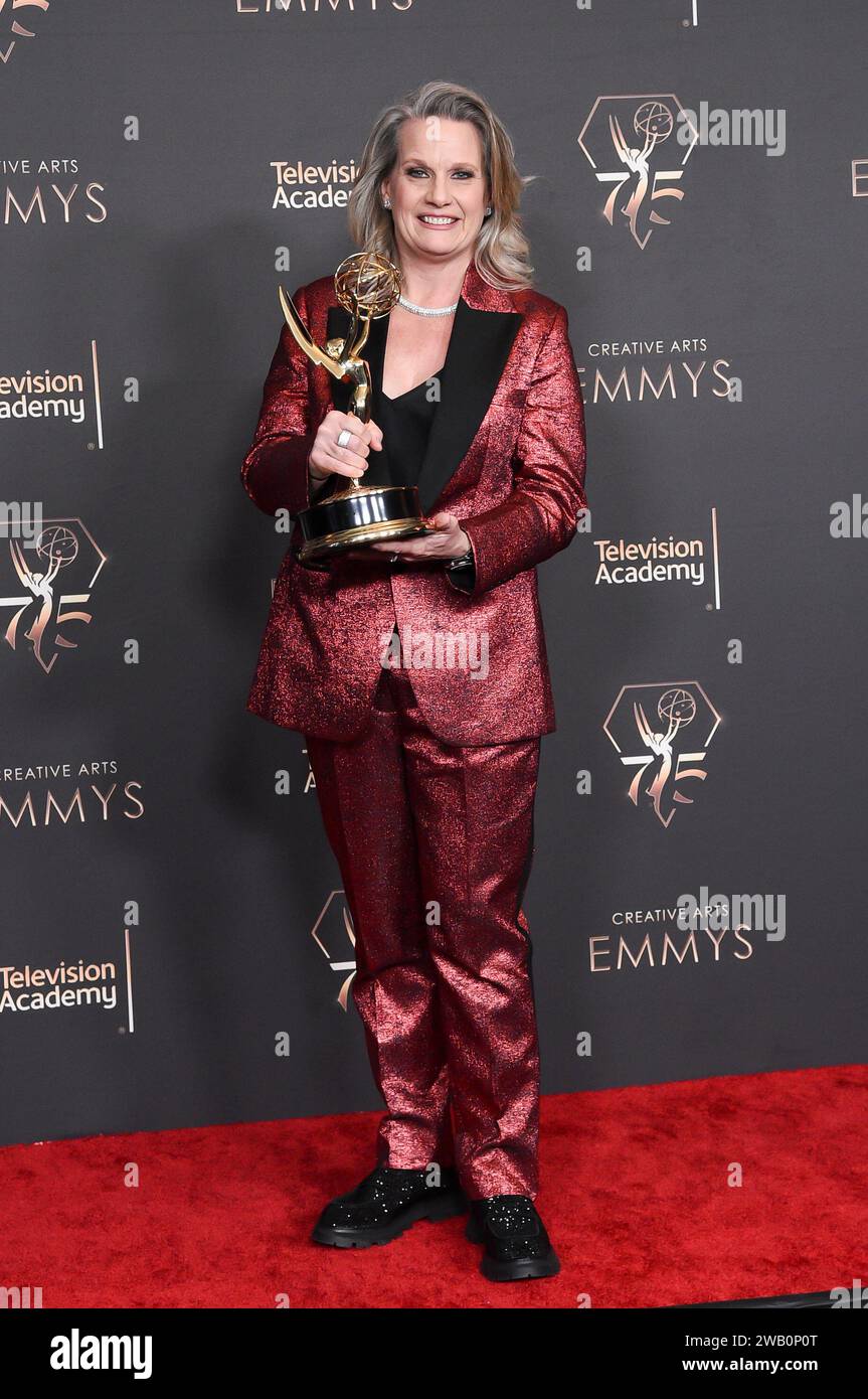 Liz Patrick poses in the press room with the award for outstanding ...