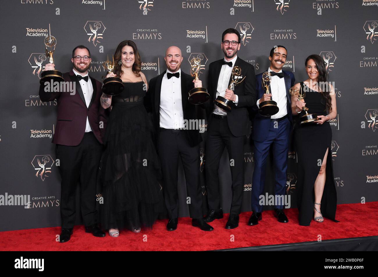 The team from "Succession: Controlling the Narrative" pose in the press ...